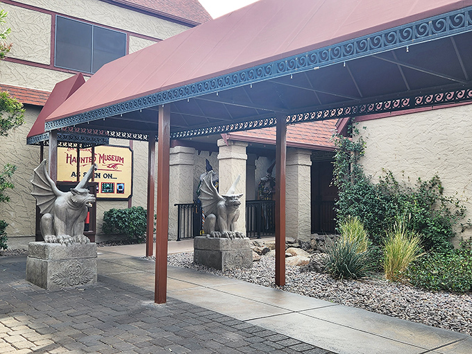 The entrance pathway features twin gargoyles—because one supernatural guardian just wasn't enough to keep the spirits in check.
