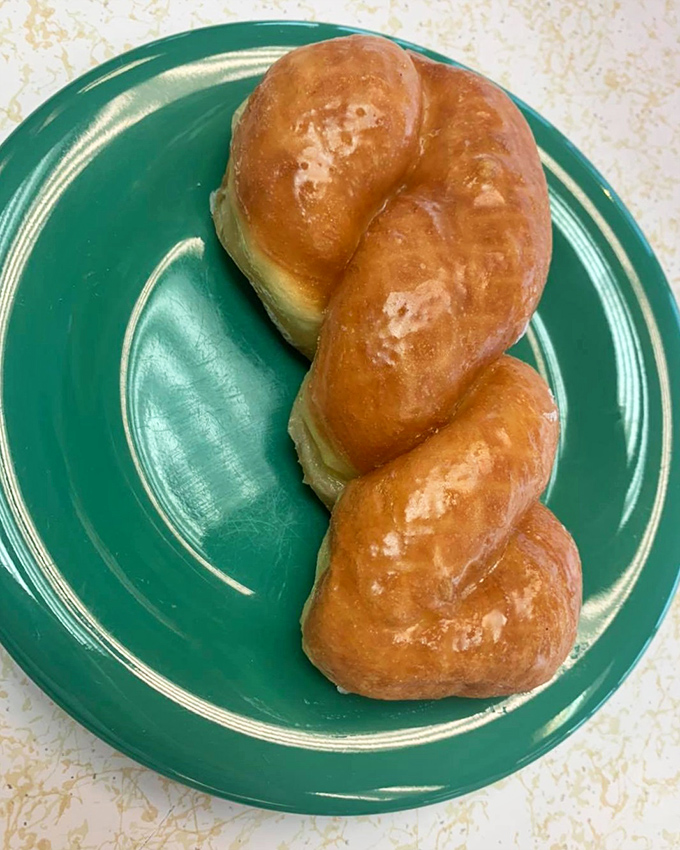 The glazed twist isn't just a donut&mdash;it's edible architecture, a golden braid of dough that somehow manages to be both substantial and ethereally light.