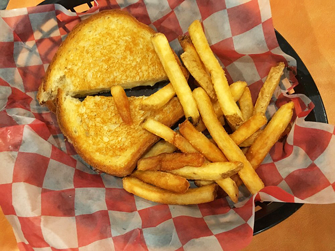 This grilled cheese isn't just a sandwich&mdash;it's a golden-brown masterpiece with fries that could make a Frenchman weep with joy.