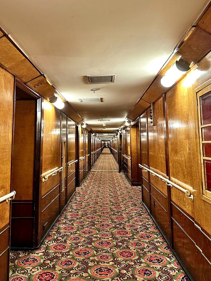 The Queen Mary's wood-paneled corridors stretch seemingly into infinity, creating the perfect setting for both historical tours and late-night ghost hunts.