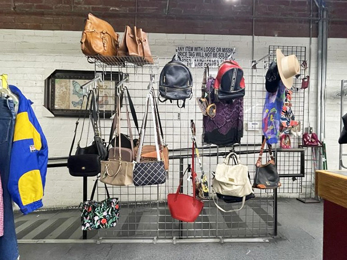 Handbags and backpacks display their stories on wire grids, each one carrying tales of adventures taken.