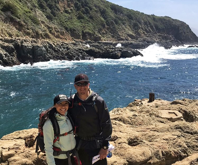 Adventure partners against the backdrop of Big Sur's dramatic coastline. Some friendships are measured in miles, views, and shared trail mix.