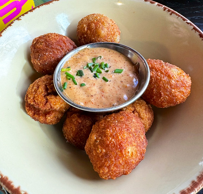 These hush puppies aren't just fried&mdash;they're spheres of crispy magic with dipping sauce. Southern comfort reimagined for the Ohio palate.