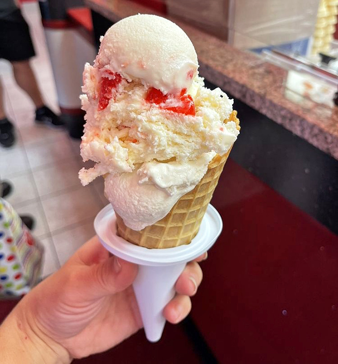This isn't just ice cream &ndash; it's architecture. A waffle cone cathedral housing strawberry-studded vanilla that makes adults remember what wonder feels like.
