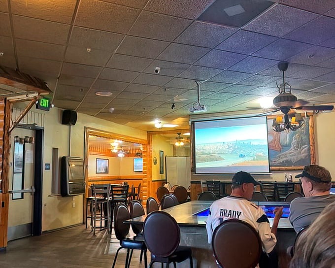 A dining room where sports fans and food enthusiasts find common ground. The big screen might show the game, but the real spectacle arrives on your plate.