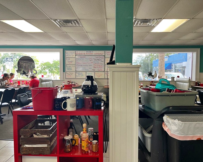 The dining room hums with conversation and coffee refills, a morning ritual where strangers become neighbors over shared breakfast bliss.