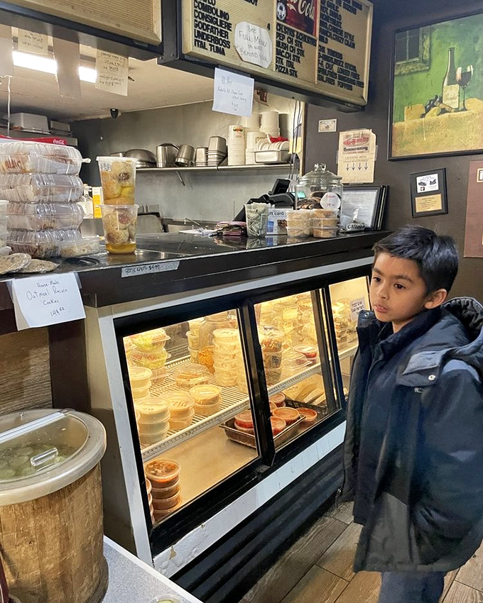 Behind the counter, where sandwich dreams become reality—the heart of operations where every hoagie is built with practiced precision.