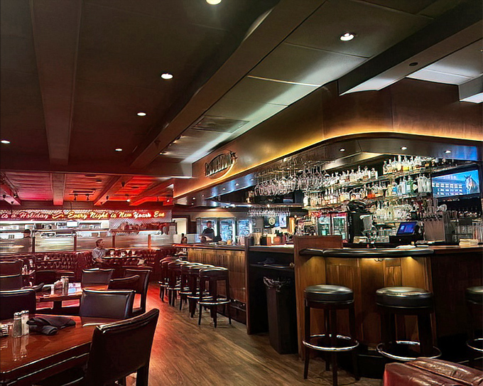 The bar gleams with amber bottles like a library of liquid joy. Wood, leather, and the promise of perfectly mixed drinks.