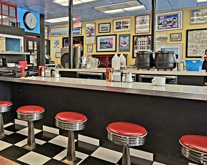 Classic diner counter culture lives on with these red stools and checkered floors. This isn't retro design&mdash;it's authentic Americana preserved like a time capsule.