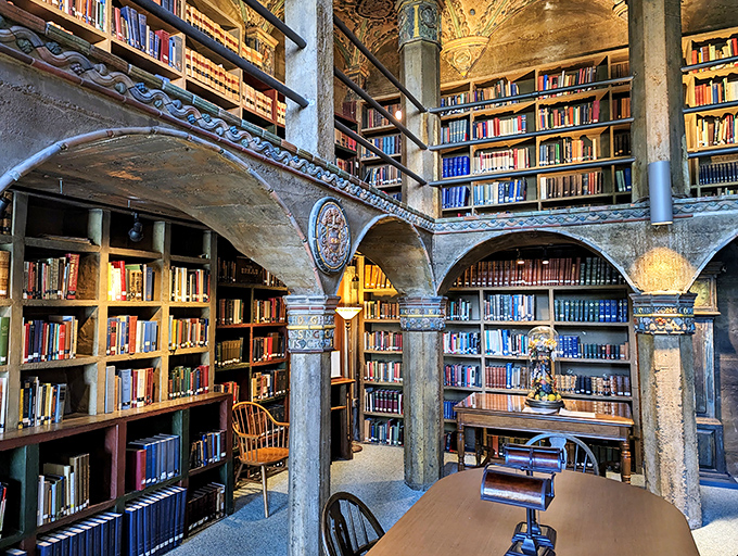 The library feels like what would happen if Beauty and the Beast's famous scene took place in a concrete bunker designed by someone with excellent taste in books.