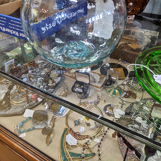 Beneath glass, yesterday's adornments await tomorrow's admirers&mdash;each brooch and pendant carrying stories we can only imagine.