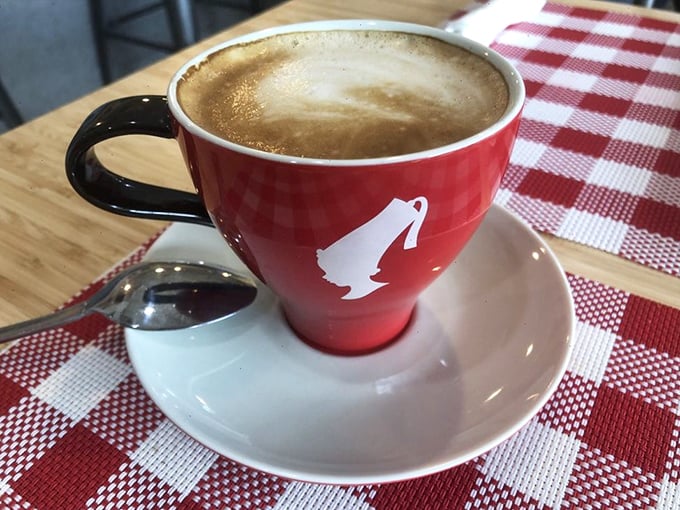 Their coffee comes in cups as red as a Parisian lipstick mark, delivering that perfect morning kiss of caffeine with European flair.