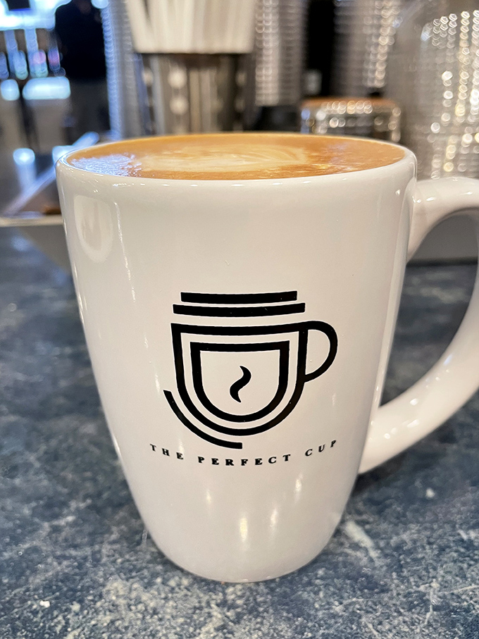 Latte art so pretty you almost feel guilty disturbing it. Almost. The Perfect Cup's logo mug makes every coffee selfie Instagram-worthy.