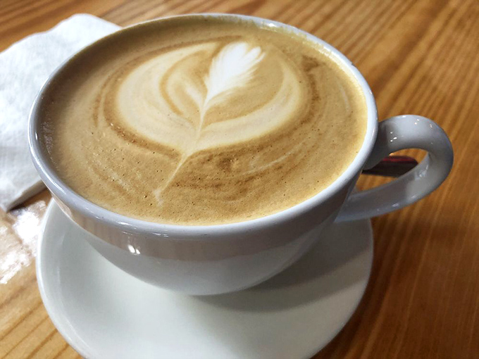 Coffee art so pretty you almost don't want to drink it. Almost. The perfect latte leaf pattern practically whispers, "I'm worth the caffeine jitters."