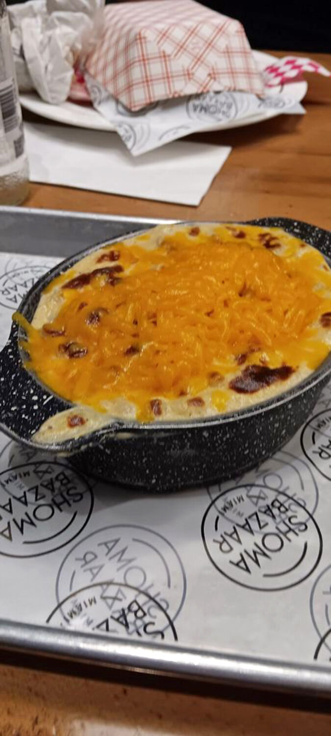 Mac and cheese that doesn't apologize for its indulgence. That golden crust is the barbecue side dish equivalent of a sunset worth pulling over for.