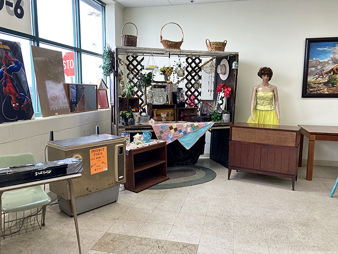 This eclectic vignette featuring a mannequin in sunny yellow feels like walking onto the set of a Wes Anderson film about vintage retail therapy.