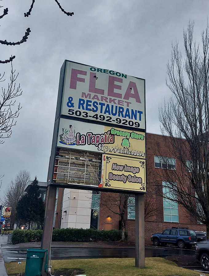 The roadside sign stands tall against Oregon's moody skies, a landmark for those who understand that true value often hides in unassuming packages.