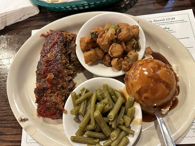 The fish platter at Clyde's comes with enough sides to constitute a United Nations of comfort food. That cornmeal crust deserves citizenship everywhere.