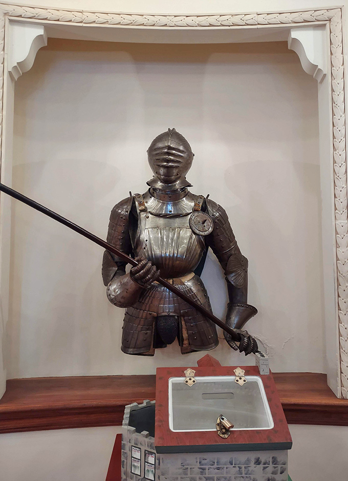 This medieval armor stands guard in its alcove, silently judging your casual attire while remembering centuries of more formal dress codes.