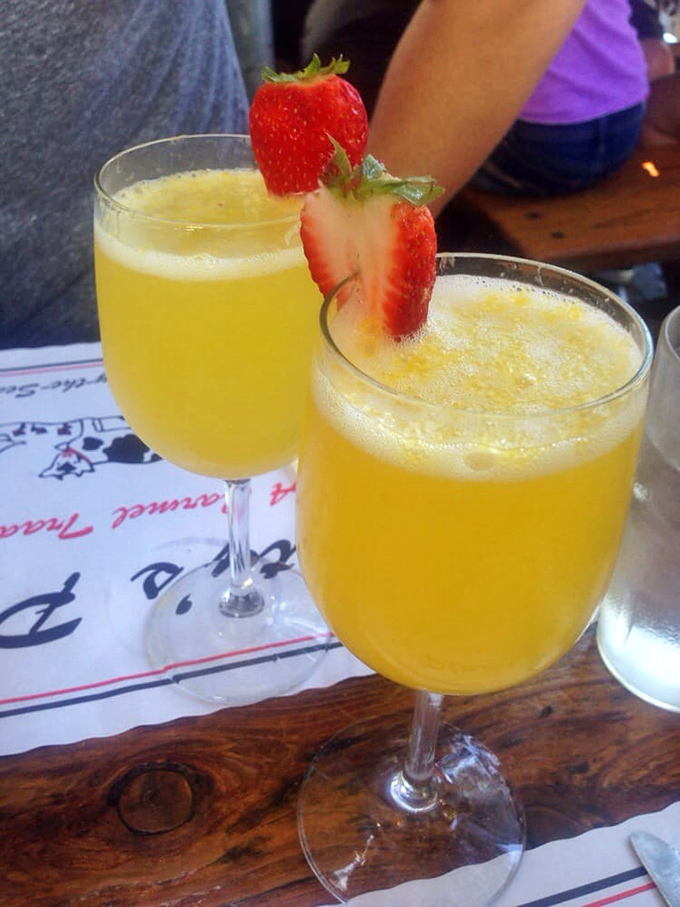 Mimosas garnished with strawberries: because sometimes breakfast needs to sparkle like morning sunshine in a champagne flute.