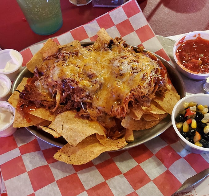 Nachos that don't skimp on the good stuff&mdash;a mountain of chips buried under an avalanche of pulled pork, cheese, and all the fixings. Sharing optional but not recommended.