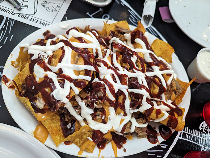 BBQ nachos that laugh in the face of subtlety &ndash; a mountain of chips, meat, sauce, and cheese that requires strategy and stamina.