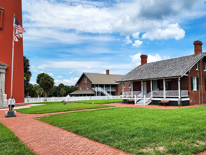 White picket fences and brick pathways connect the keeper's dwellings, a scene so quintessentially American it could be on a postage stamp.