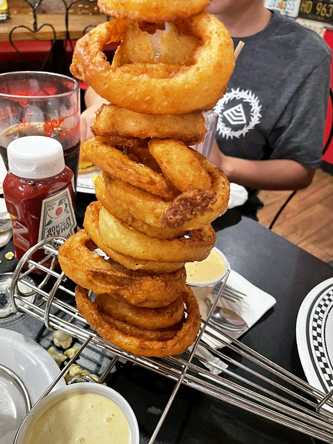 These onion rings aren't stacked&mdash;they're towering with the confidence of a Vegas poker player holding four aces. Crispy, golden, and unapologetically enormous.