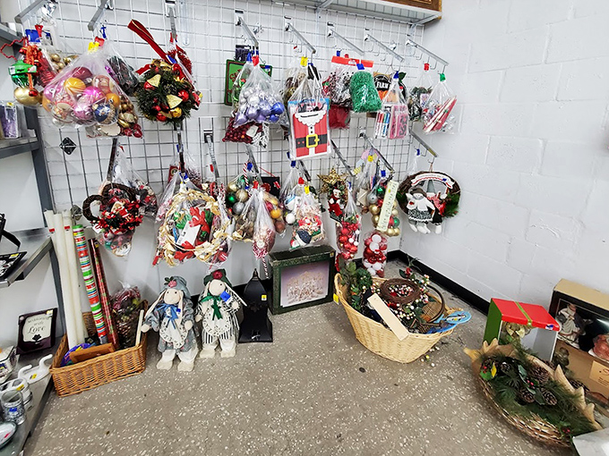 Holiday decorations waiting patiently for their season, like festive time travelers stuck in the wrong month. Santa looks surprisingly comfortable in July.