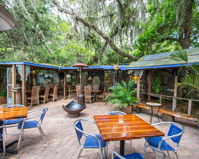 Outdoor dining under Spanish moss where conversations flow as easily as the cocktails. Mother Nature's dining room beats any interior designer's vision.