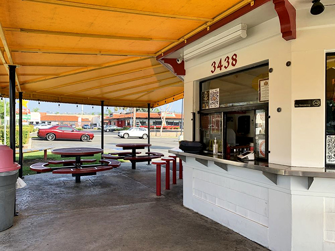 The outdoor seating area&mdash;where strangers become friends united by the universal language of "mmm" and "pass the napkins."