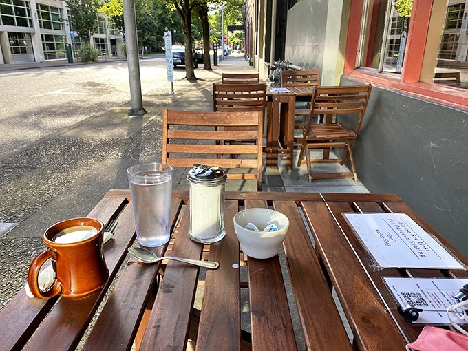 Coffee tastes better outdoors, especially when it comes in a sturdy mug at a wooden table with Portland's urban landscape as your backdrop.