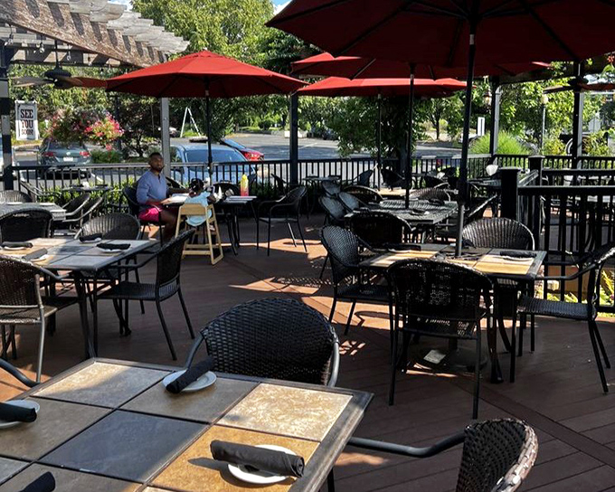 Red umbrellas and outdoor seating offer the perfect setting for al fresco dining adventures.