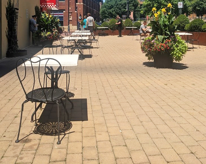 Outdoor seating that invites lingering conversations and the kind of people-watching that makes lunch break feel like a European holiday.