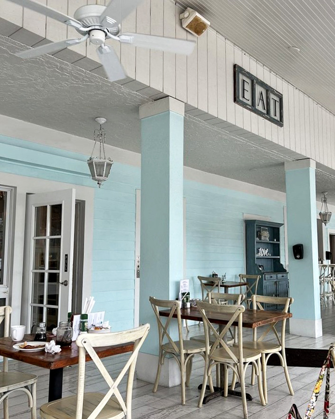 The outdoor dining area whispers "stay awhile" with its coastal blue columns and simple "EAT" sign&mdash;as if we needed convincing.