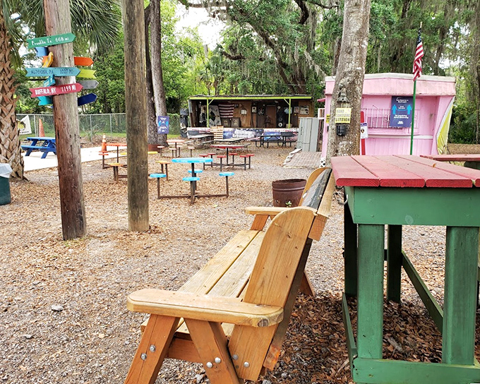 The outdoor seating area offers a tranquil escape under Florida's oak trees, where picnic tables invite you to linger over your feast.
