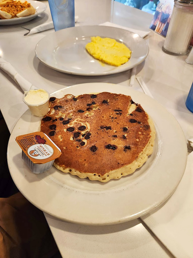 A blueberry pancake that spans the plate like a delicious full moon. Paired with scrambled eggs for the breakfast of champions.