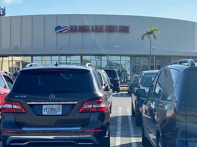 The parking lot tells the real story—Mercedes parked beside minivans. Great deals create the most democratic shopping experience in Florida.