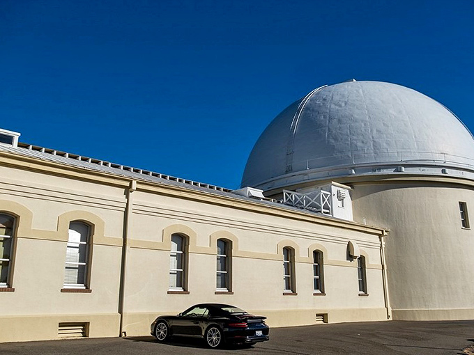 Luxury meets science when fancy cars park beside century-old astronomy facilities. Even your vehicle gets a view at this elevation!
