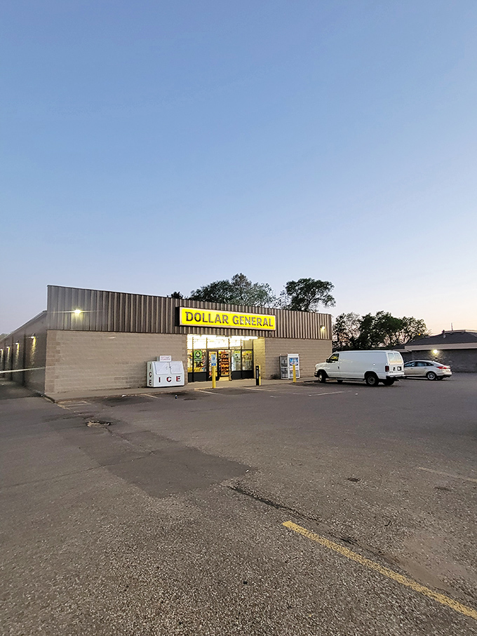 As dusk settles, the glowing storefront transforms into a nocturnal oasis for last-minute essentials and midnight snack runs.