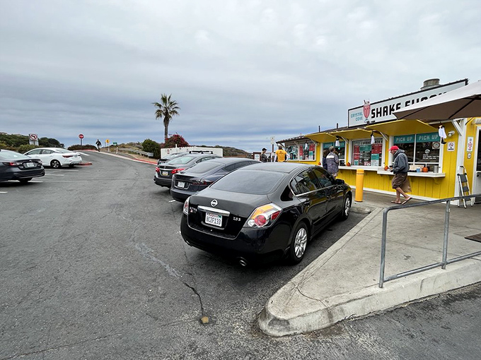 The parking lot pilgrimage—where hungry souls line up their vehicles for a taste of coastal nostalgia and ocean-view dining.