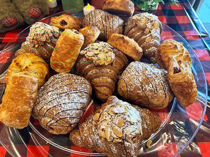 Pastries and croissants that would make a French baker weep with joy. That dusting of powdered sugar is like snow on the Alps of deliciousness.