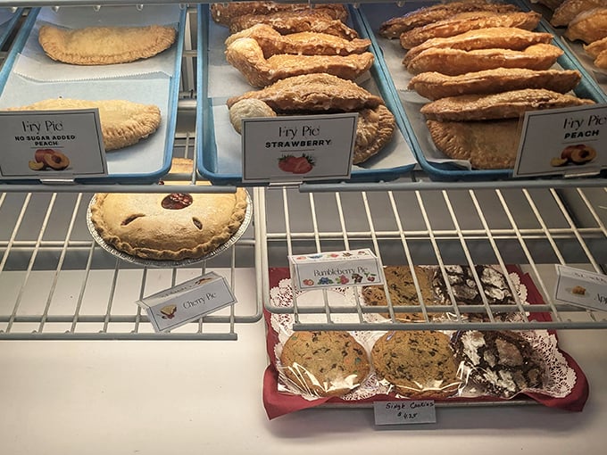Pie paradise! From fruit-filled treasures to cream-topped wonders, this display case is where diet resolutions go to die.