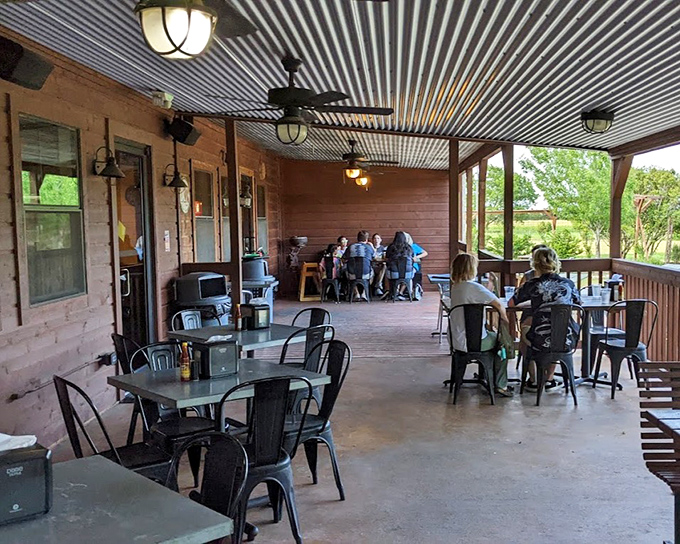 The patio where time slows down and conversations flow easier. Texas sunshine, gentle breezes, and the anticipation of fried catfish&mdash;pure bliss.