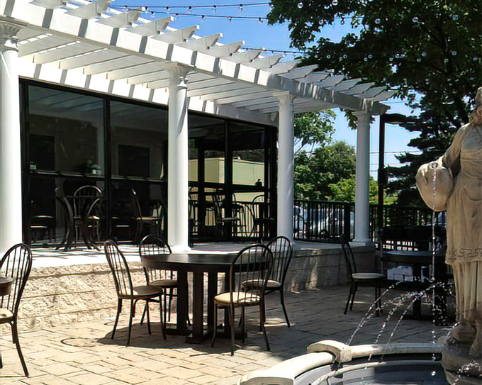 The pergola-covered patio creates a little slice of Santorini in Pennsylvania, complete with a statue that's seen more romantic dinners than a matchmaker.
