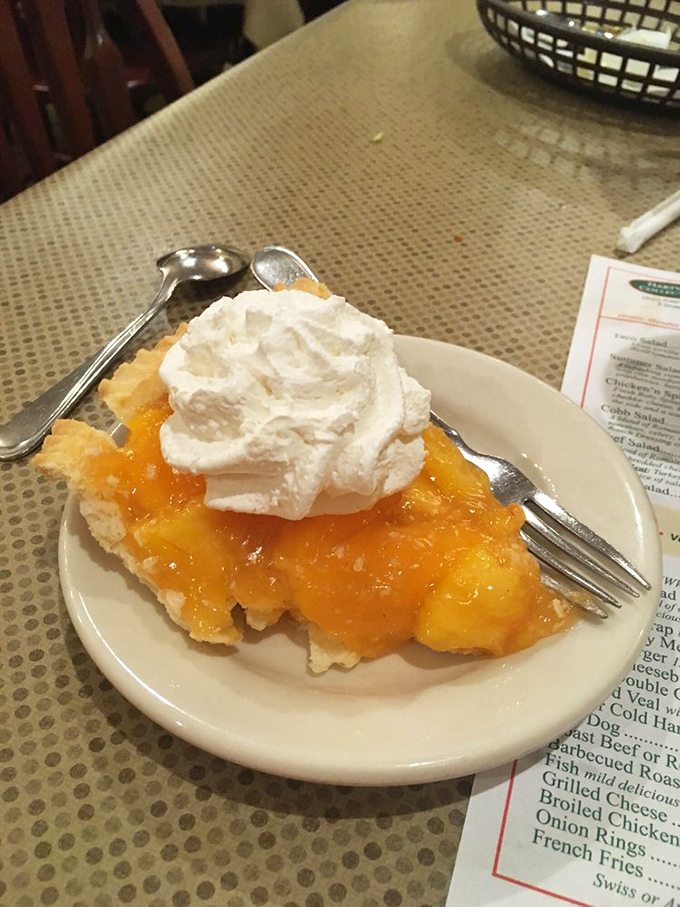 Flaky crust embraces sweet peach filling in this slice of summer that tastes like childhood memories.