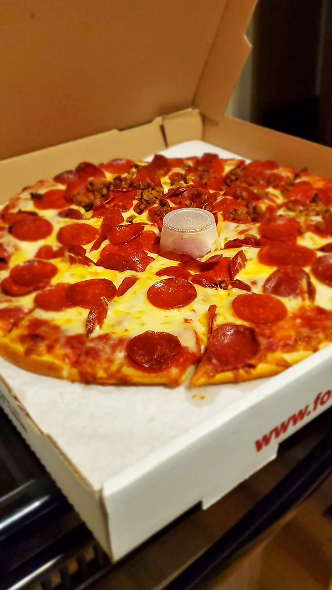 Pizza perfection doesn't need to wear a tuxedo. This pepperoni and sausage pie delivers exactly what your soul craves&mdash;no filter, no gimmicks, just glory.