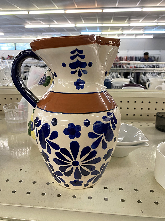 This hand-painted pitcher isn't just a vessel; it's a piece of functional art that tells stories of Sunday brunches past.