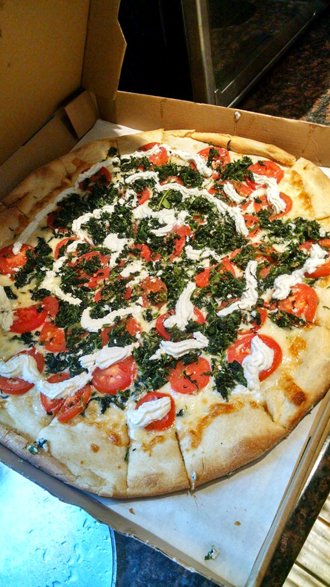 White pizza elevated to an art form. Fresh tomatoes and spinach make you feel virtuous while the cheese reminds you why you're really here.