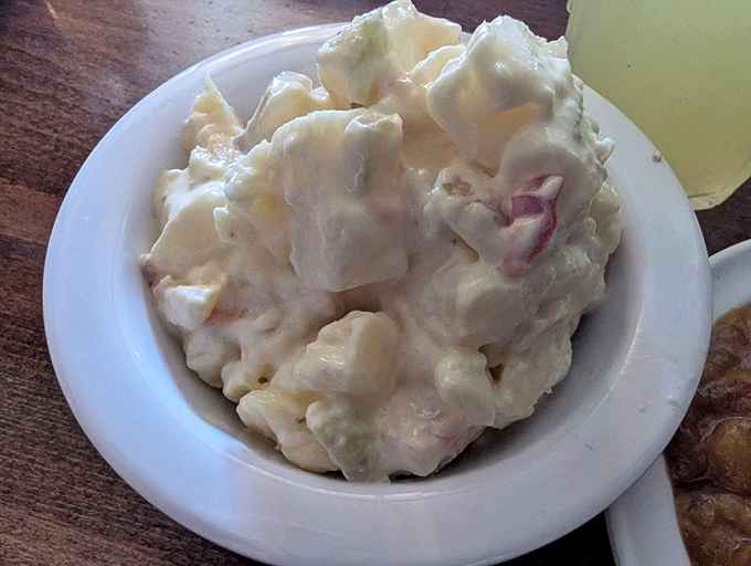Potato salad so creamy it could double as comfort therapy. The chunks of potato and flecks of red onion add texture to this cloud-like side.